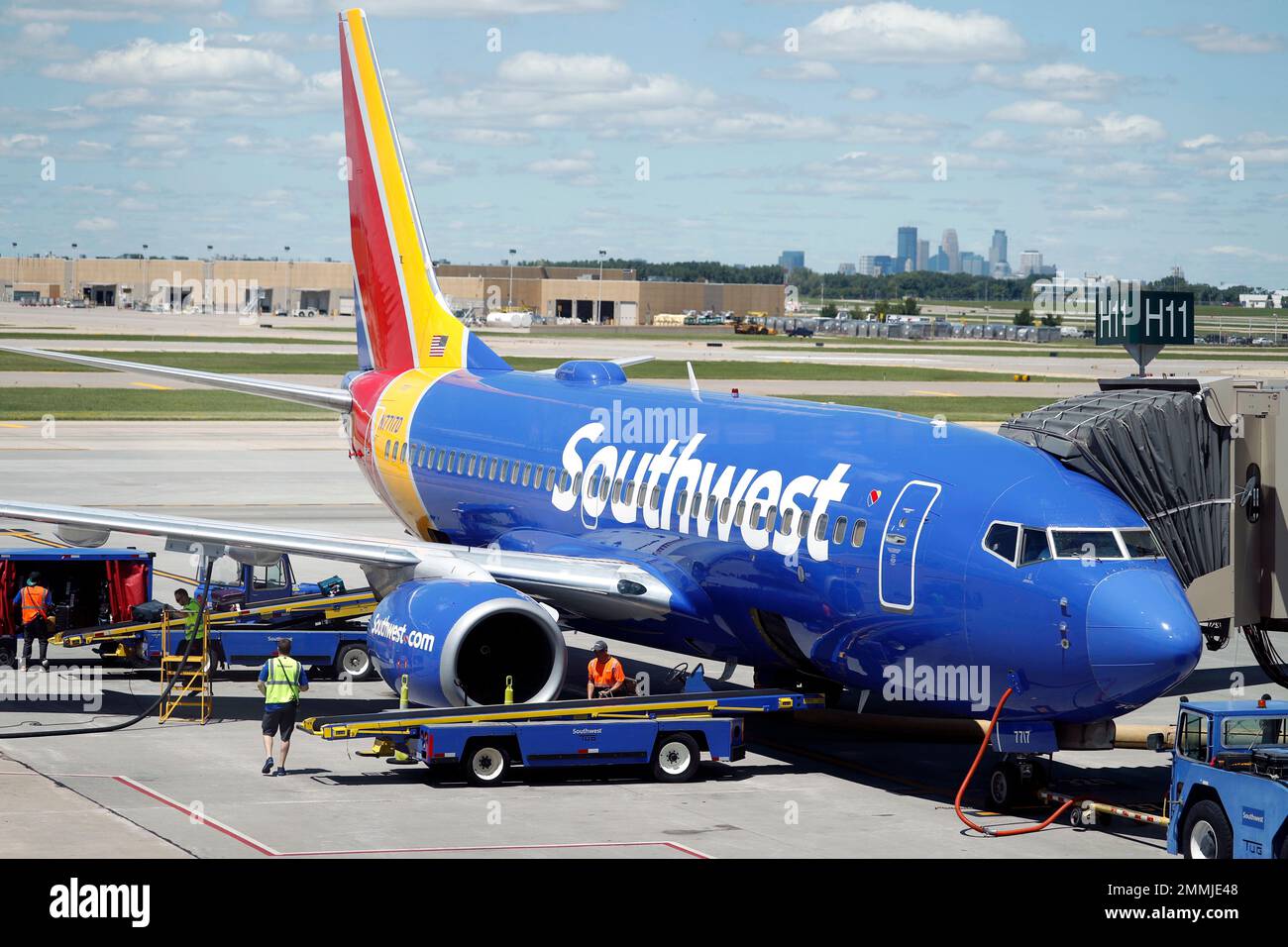 In this Tuesday, July 17, 2018, photograph, ramp workers prepare a ...