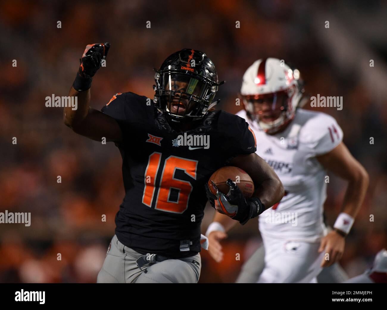 Oklahoma State linebacker Devin Harper runs the ball during an NCAA ...