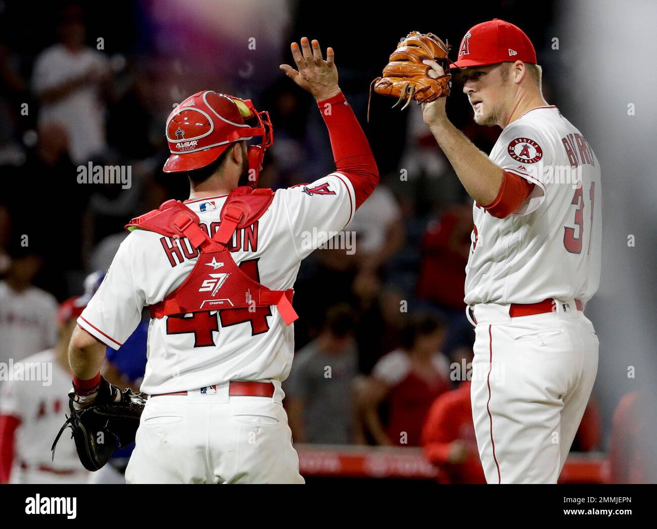 Los Angeles Angels catcher Joe Hudson and pitcher Ty Buttrey celebrate ...