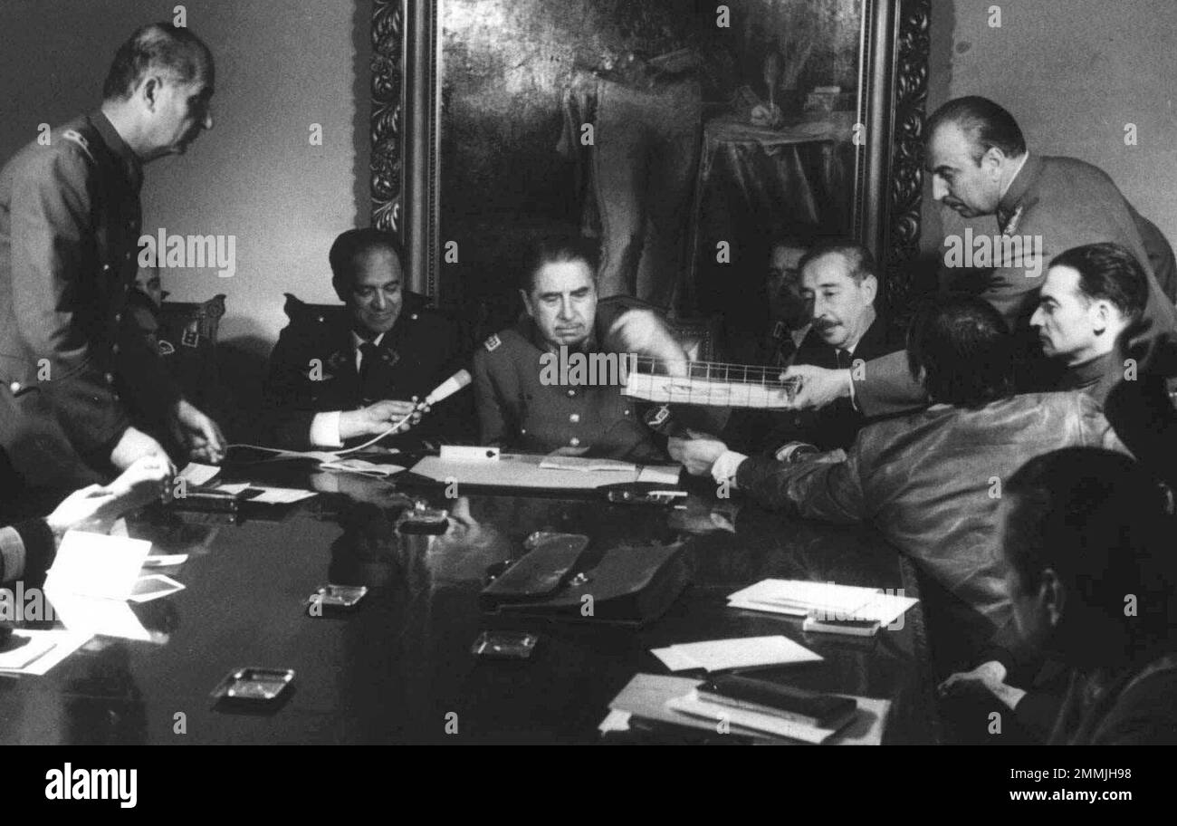 FILE - In this Sept. 20, 1973 file photo, Gen. Augusto Pinochet, center ...