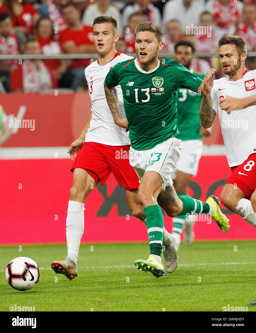 Poland's Arkadiusz Reca, left, is challenged by Ireland's Jeff Hendrick ...
