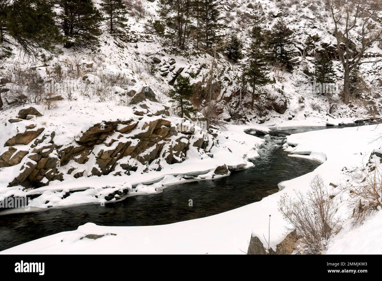 Snow-covered Clear Creek flowing through Clear Creek Canyon off of ...