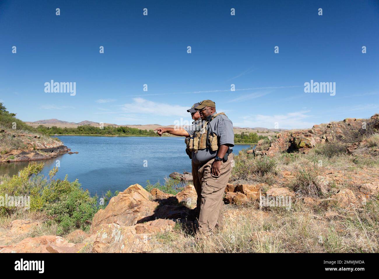 Officers Damon Wookfork and Angel Morales discuss the water levels at ...