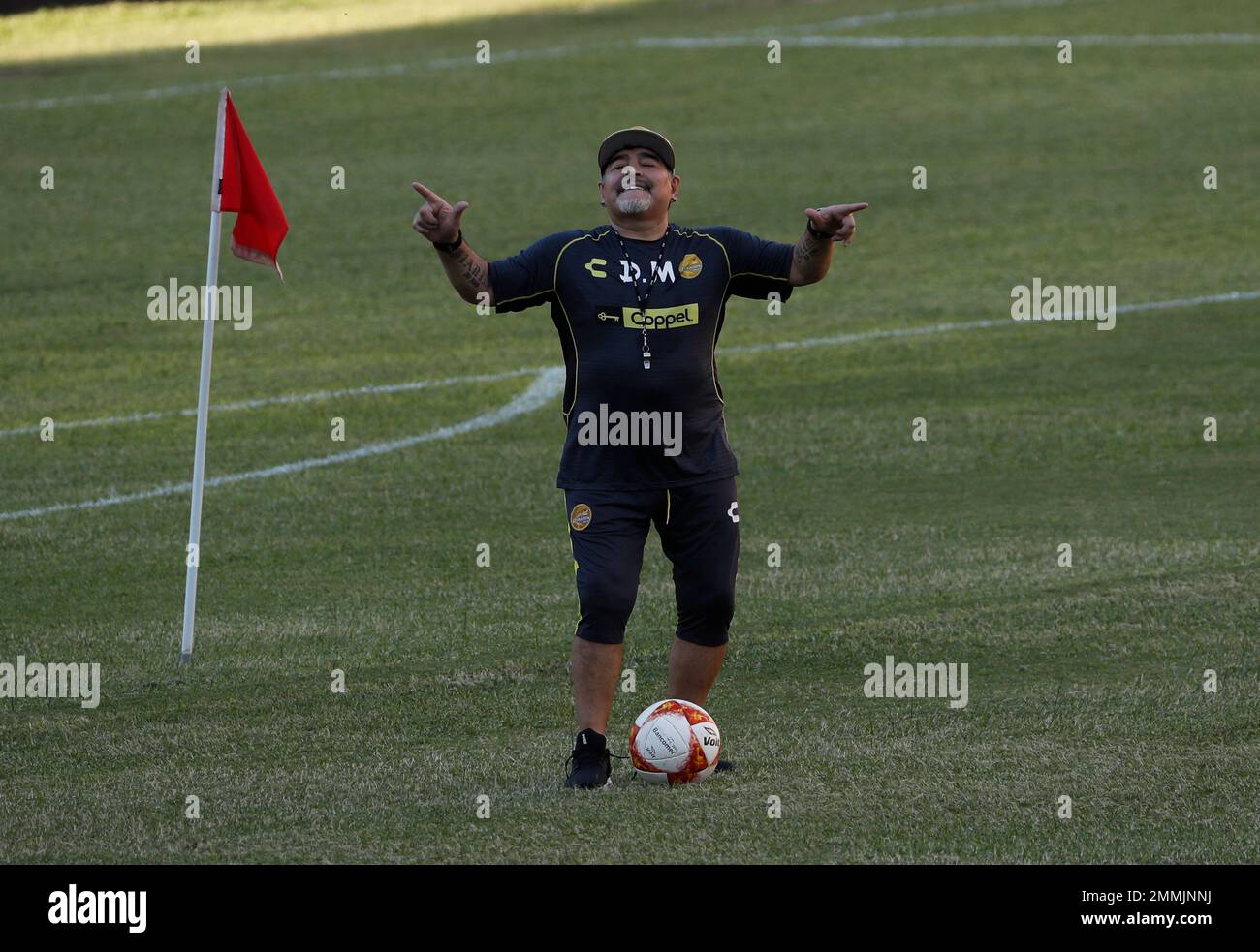 Former soccer great Diego Maradona dances on the pitch at the Dorados ...