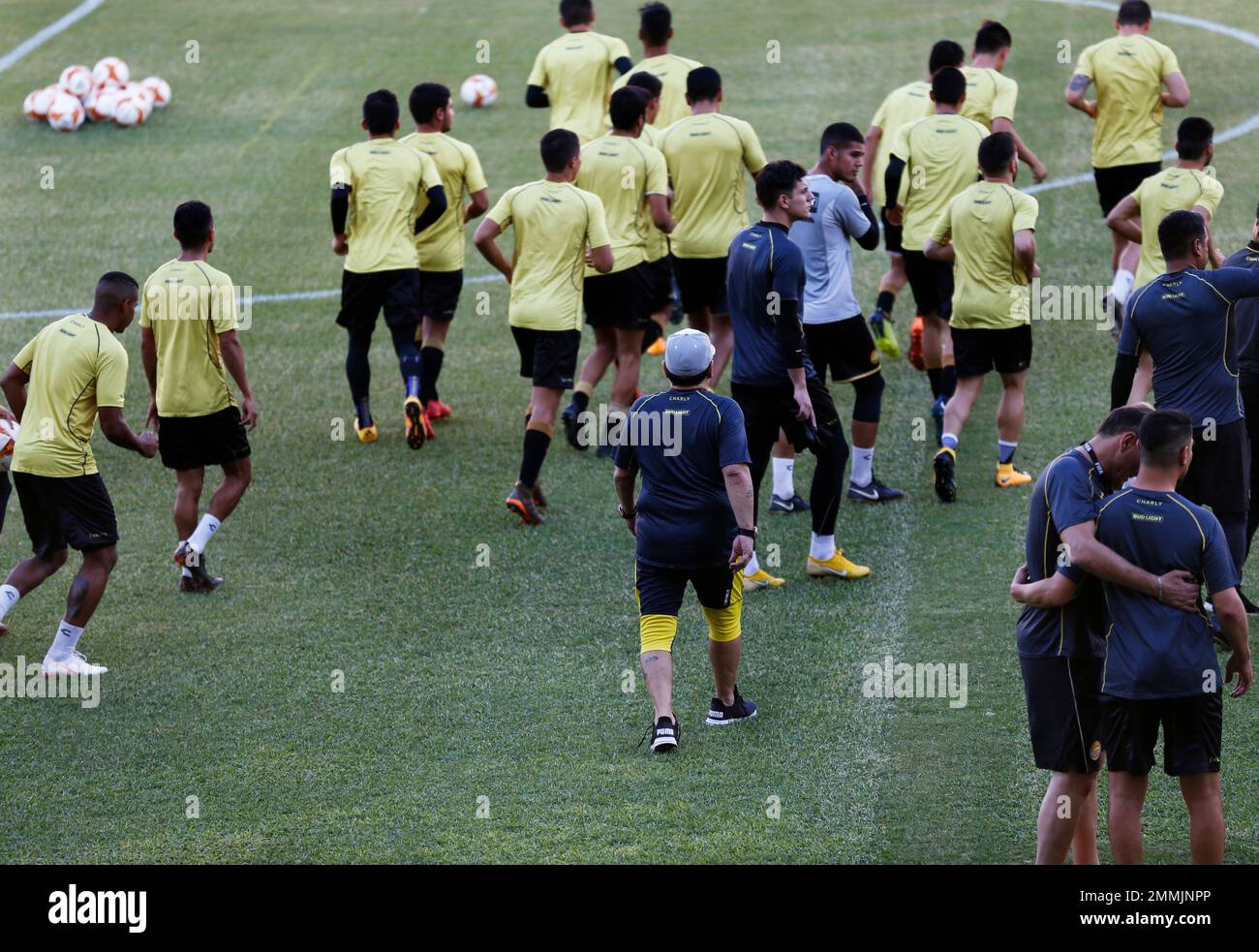 Former soccer great Diego Maradona, center, trains with his new team at ...