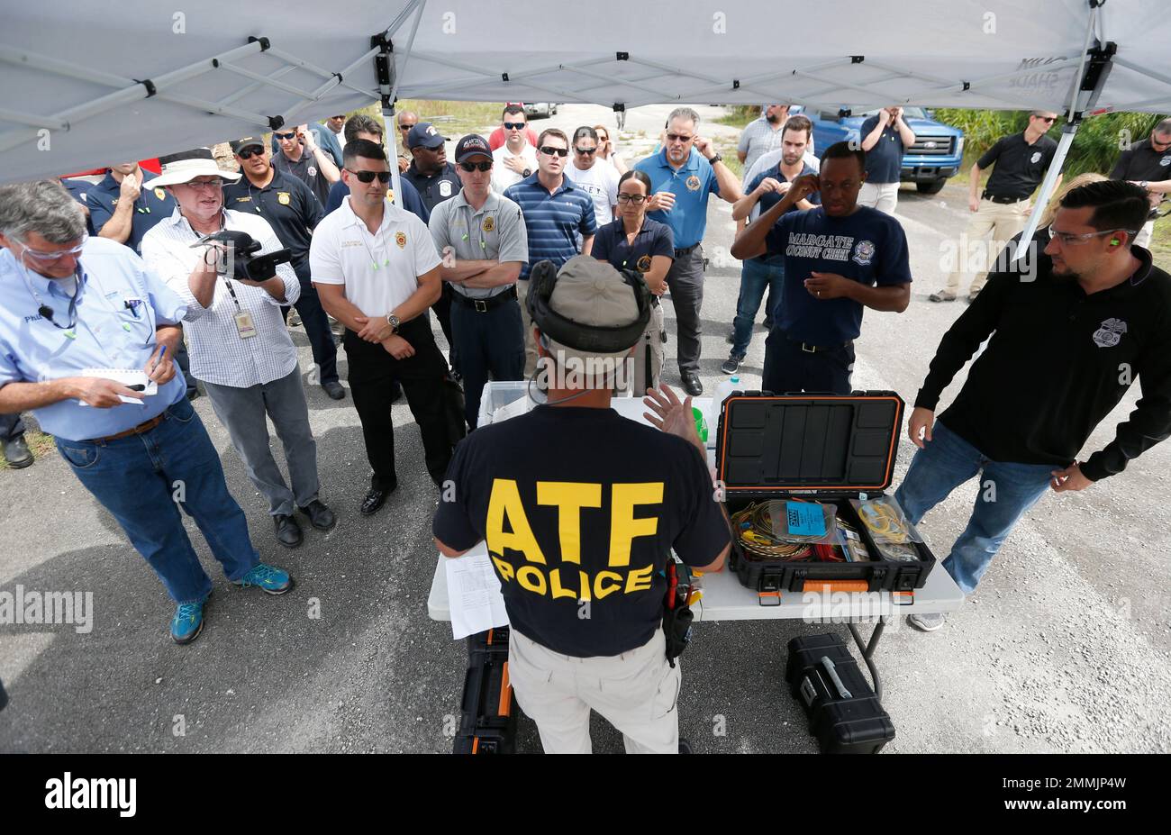 Instructor Javier Ribes, center, with the Miami Field Division of the ...