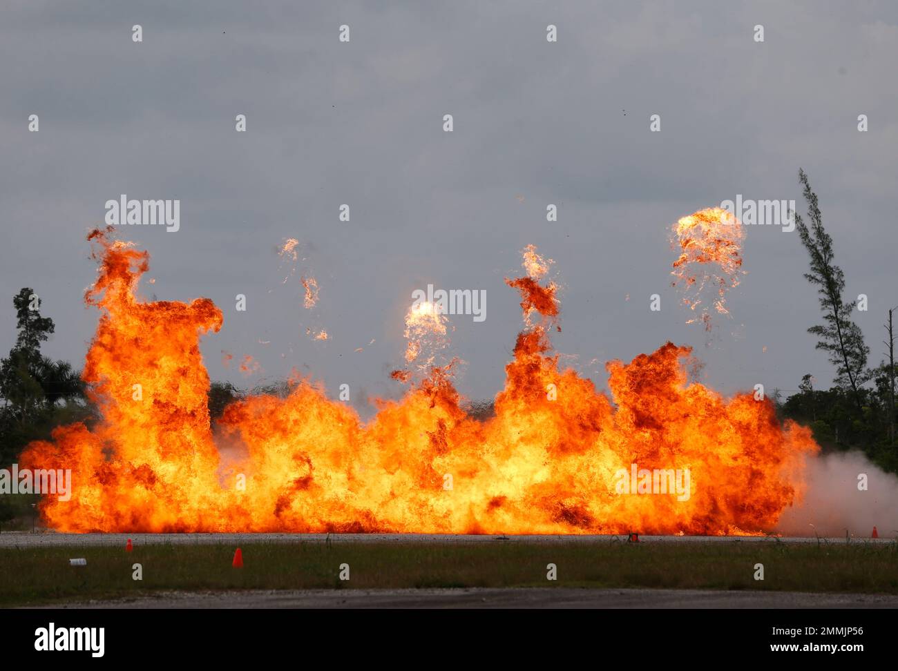 Detonating cord and gasoline are detonated during a live explosives ...