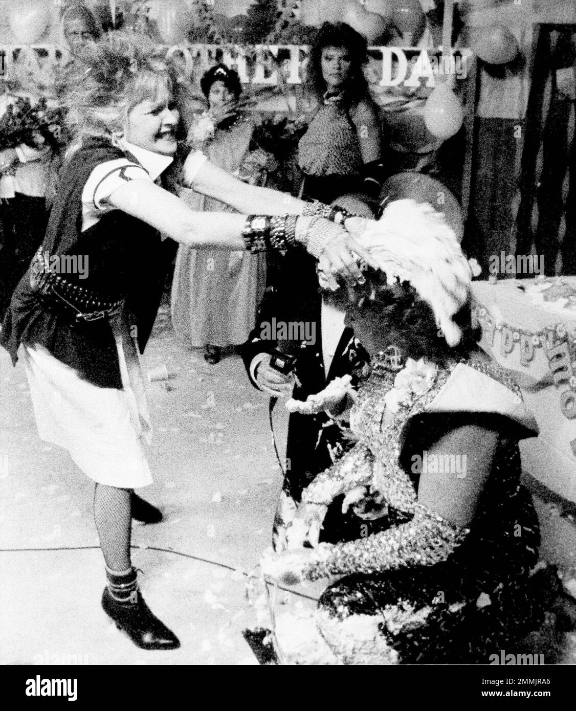 Pop star and wrestling promoter Cyndi Lauper, left, dumps a cake on the ...