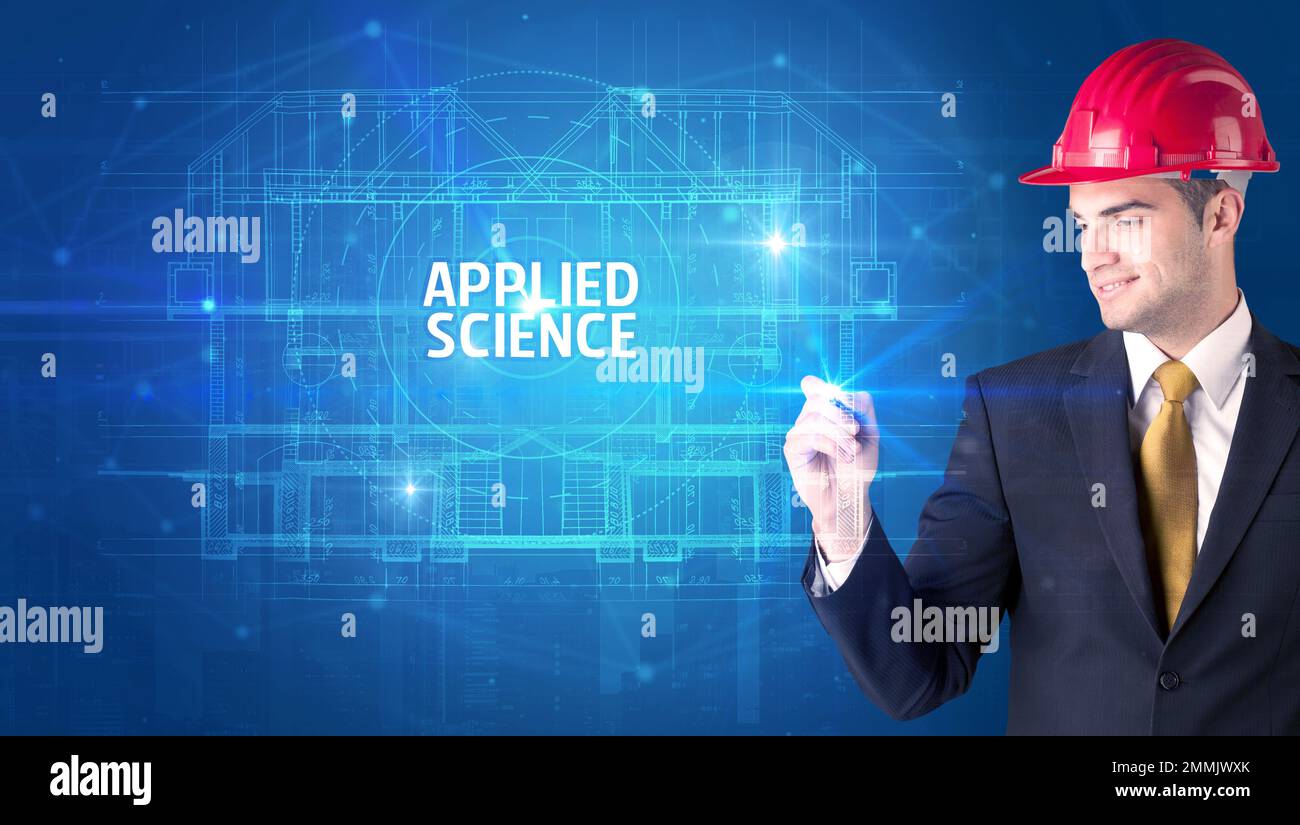 Handsome architect drawing with helmet Stock Photo - Alamy