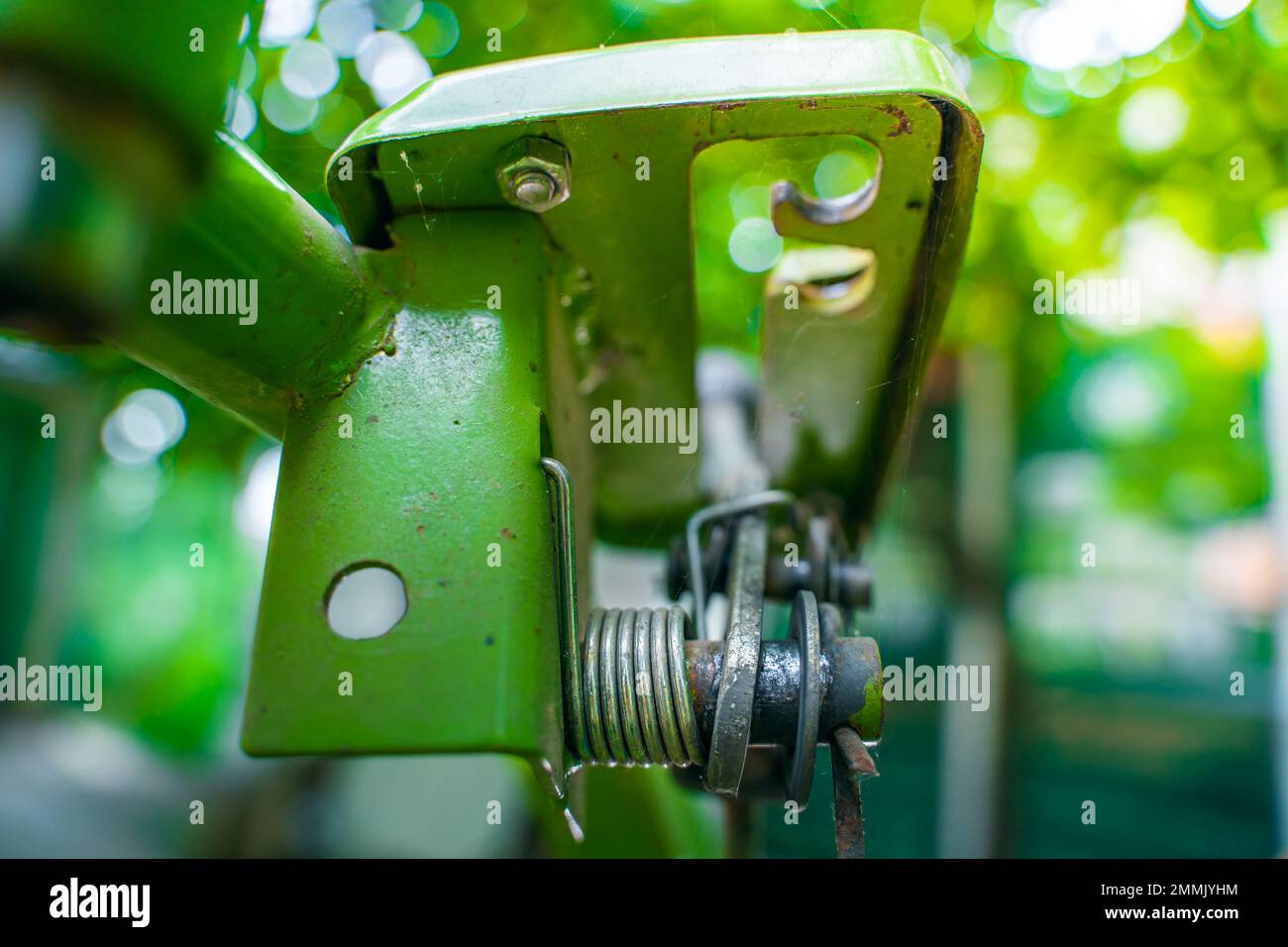 The control lever on a walk-behind tractor close-up on a blurred ...