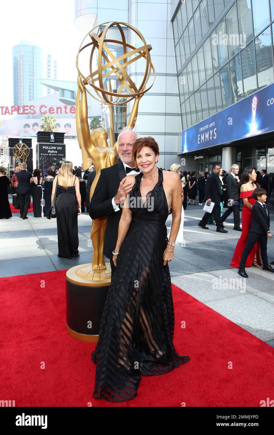 Mark McIntire, left, and Natalie Alexander arrive at night two of the Television Academy's 2018 ...