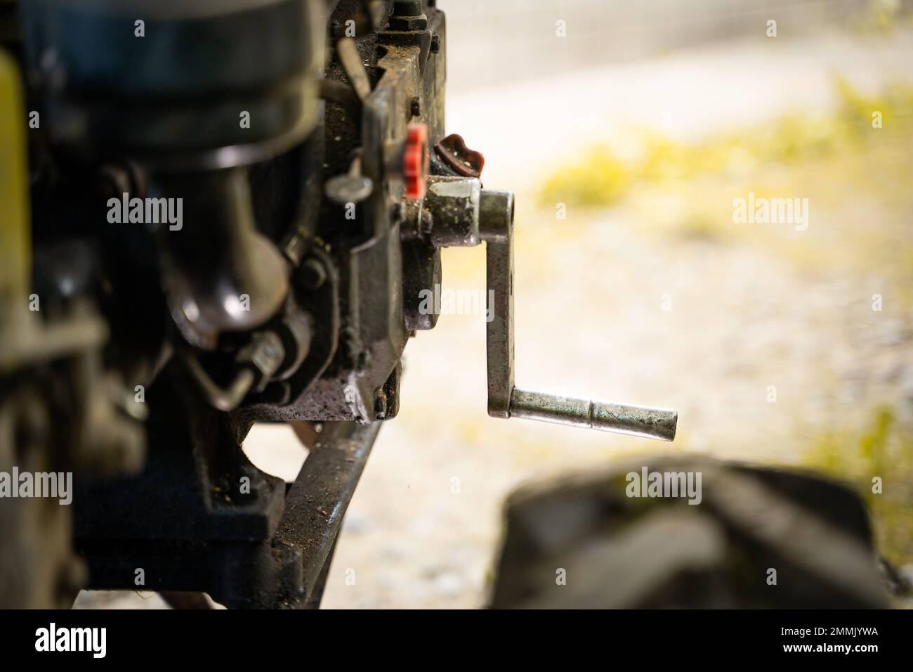 A manual starter in a walk-behind tractor engine for manually starting ...