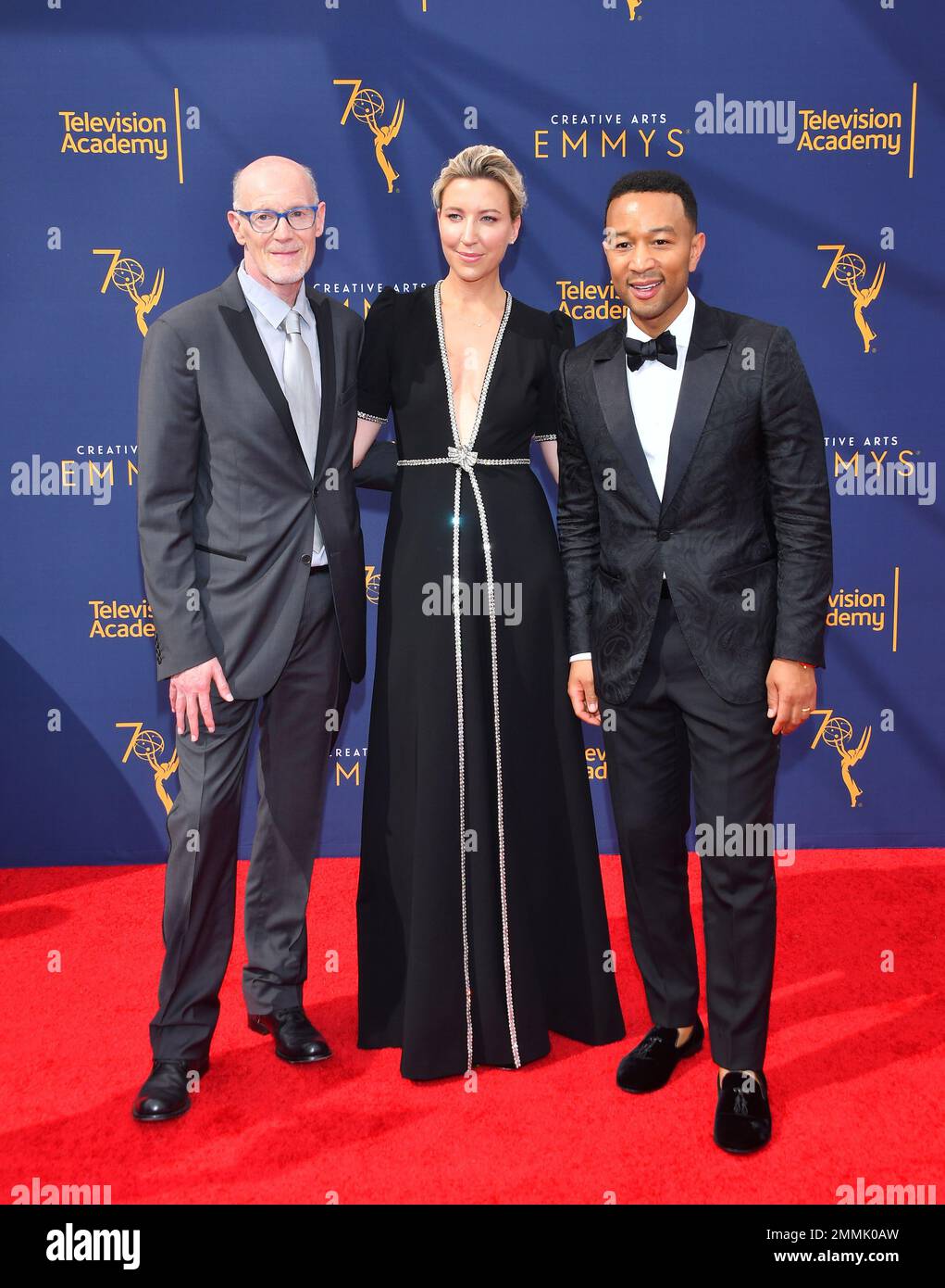 Neil Meron, from left, Ty Stiklorius and John Legend arrive at night ...