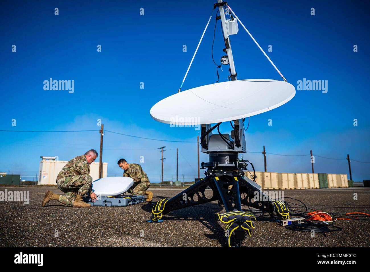 Two members of the 216th Space Control Squadron (SPCS) set up antennas ...