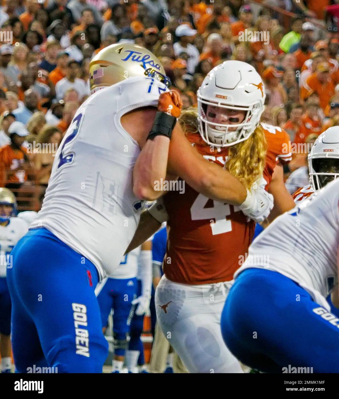 Texas lineman Breckyn Hager (44) rushes the passer while blocked by ...