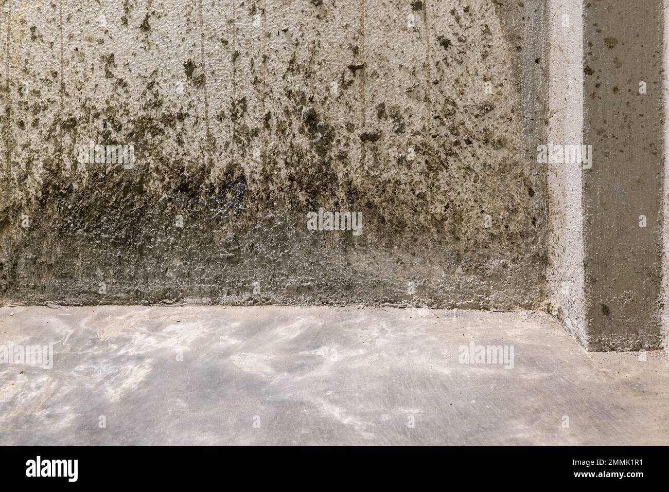 Renovation home , splashing concrete debris on wall from pour new ...
