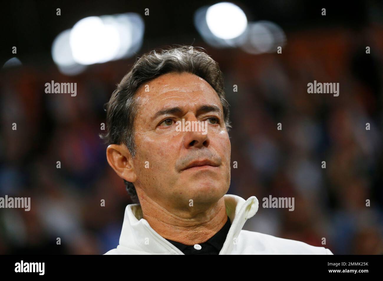 Peru assistant coach Sergio Santin watches players during the ...