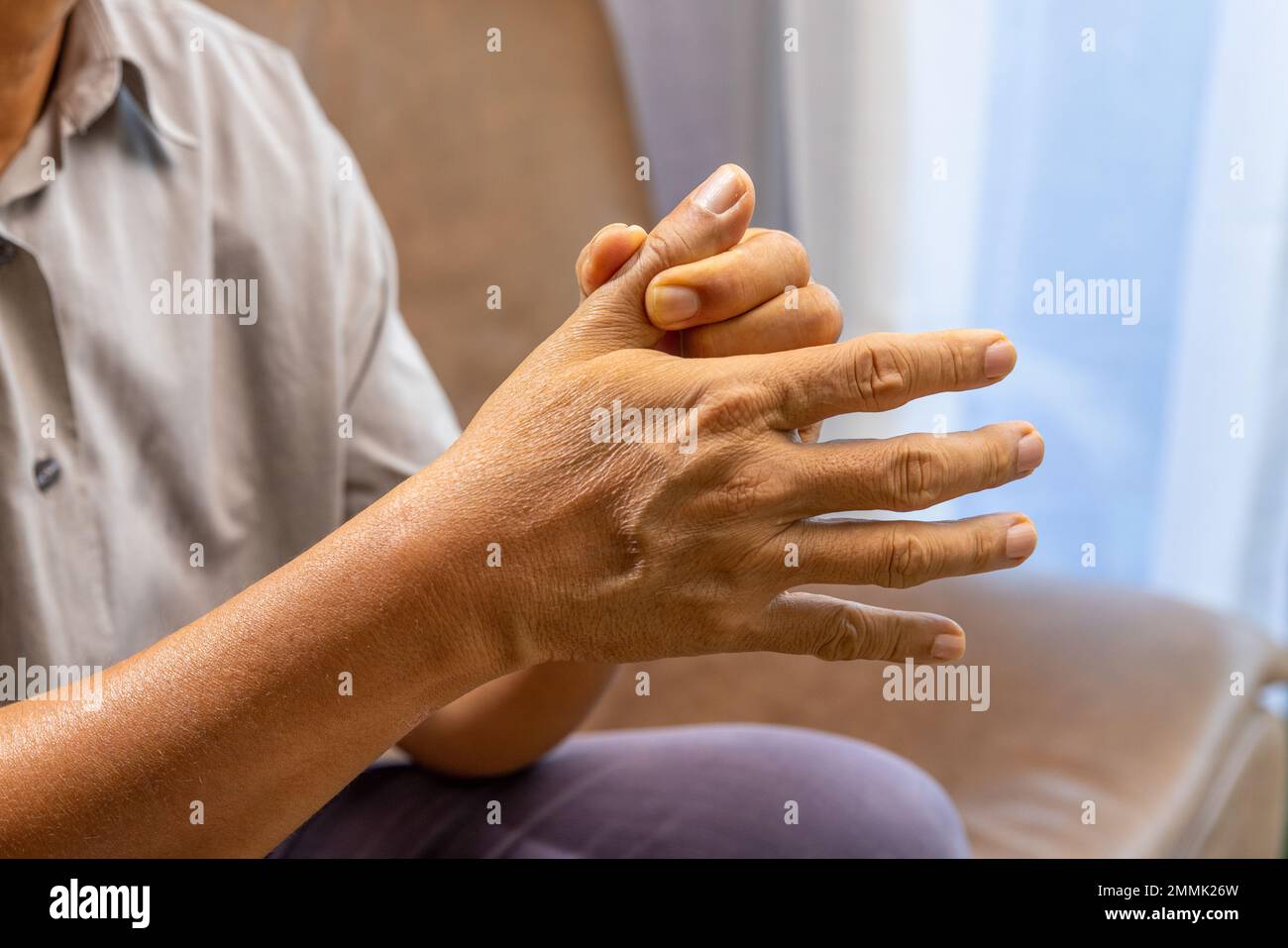 Senior man hand suffering from joint pain with gout inflammation Stock ...