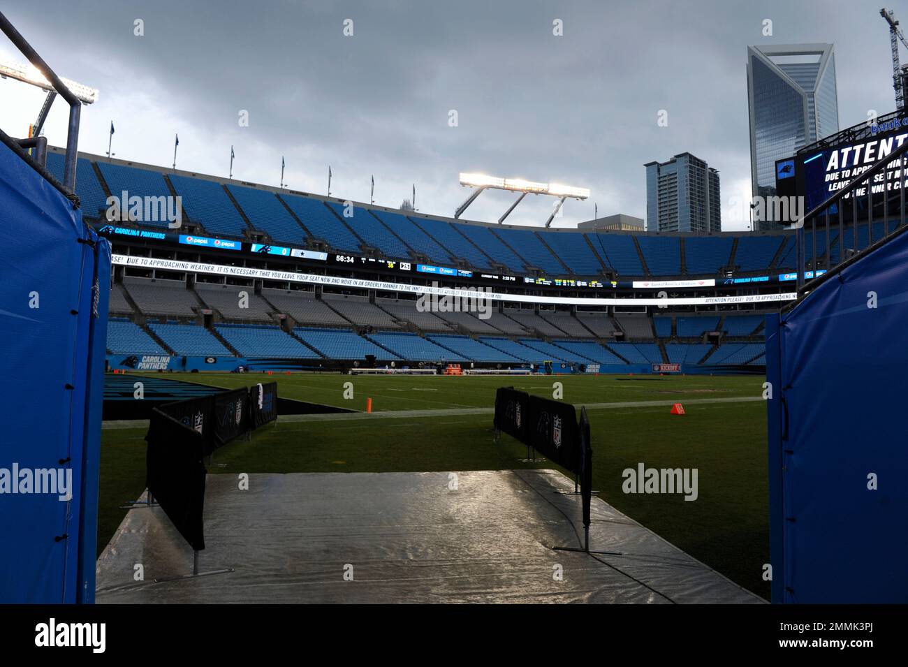 The field and stands at Bank of America stadium are empty as a storm ...