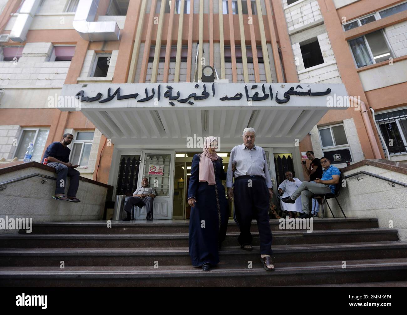 Palestinians leave the Makassed hospital in east Jerusalem, Sunday ...
