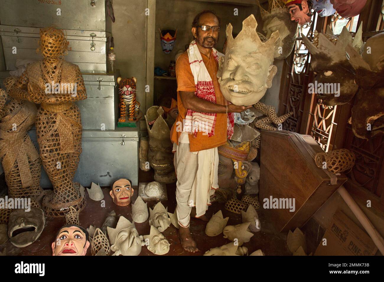 In this Tuesday, Aug. 7, 2018, photo, traditional mask maker ...