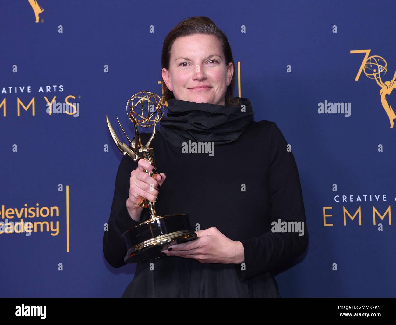 Selina MacArthur poses in the press room with the award for outstanding ...