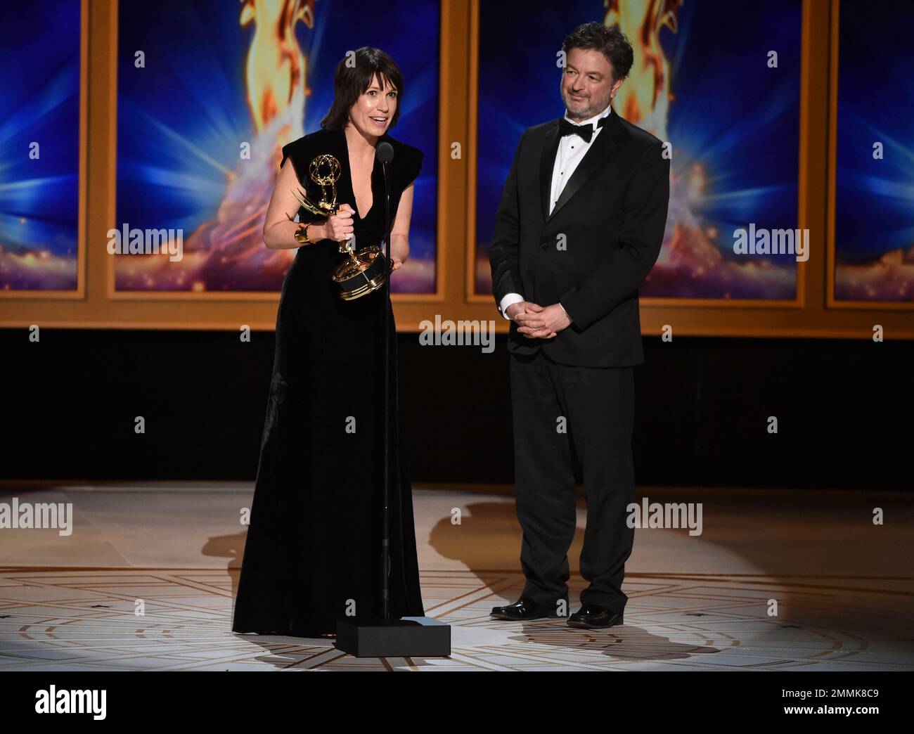 EXCLUSIVE - Deborah Riley, left, and Paul Ghirardani accept the award ...