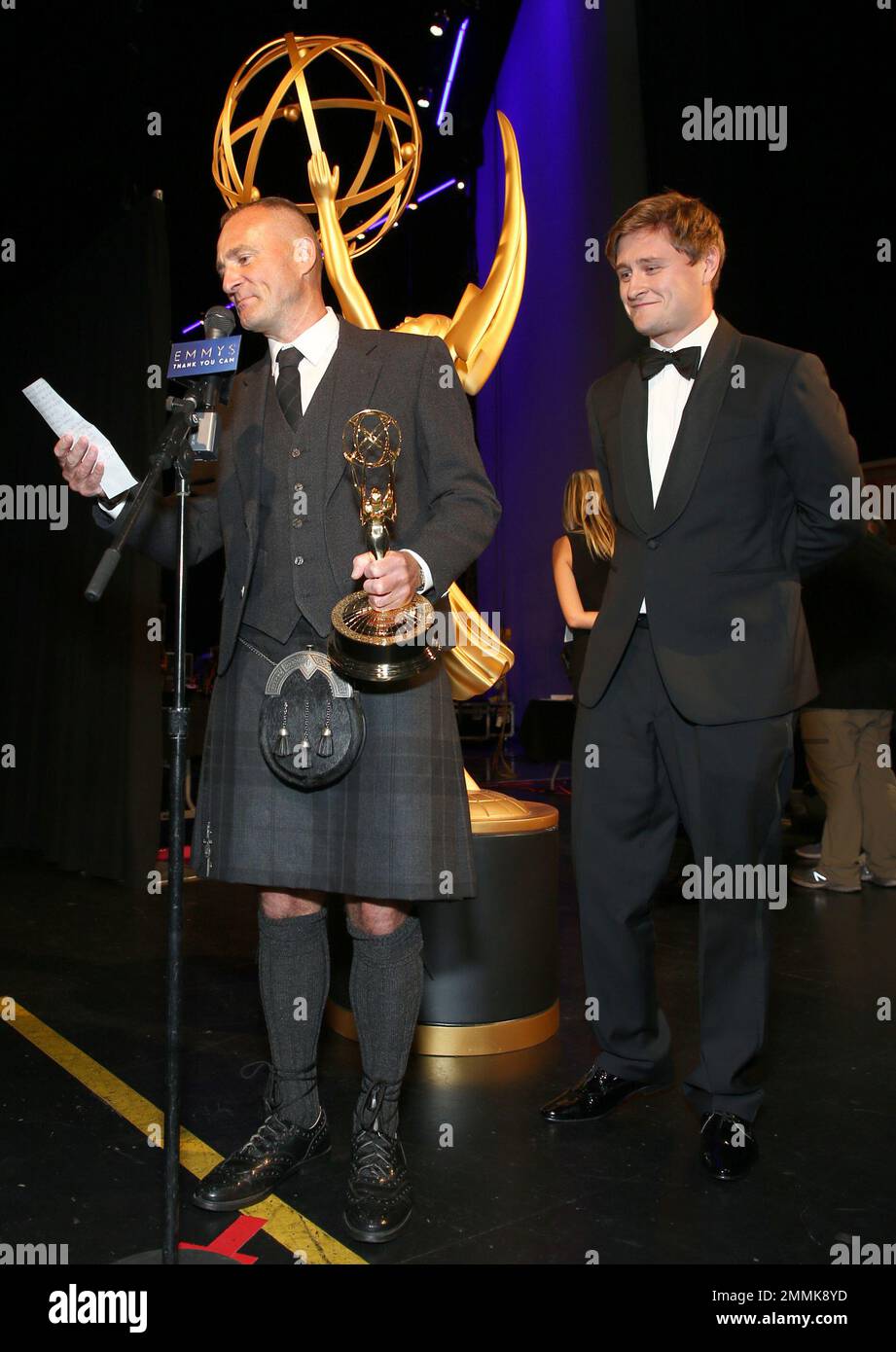EXCLUSIVE - Kenny Clark, left, and Oliver Ferris pose with the award ...
