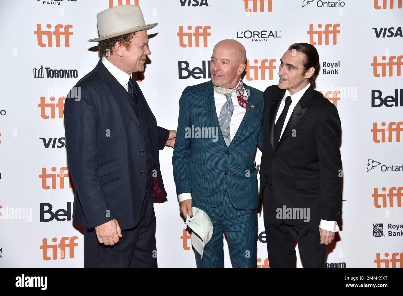John C. Reilly, from left, director Jacques Audiard and Joaquin Phoenix ...