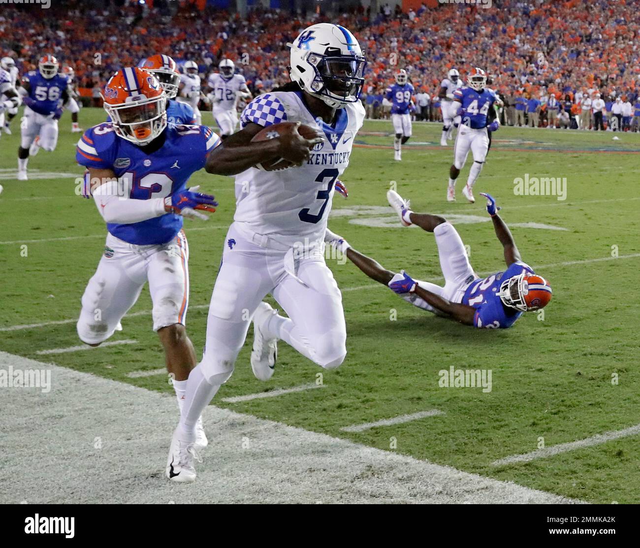 Kentucky quarterback Terry Wilson (3) is run out of bounds by Florida ...