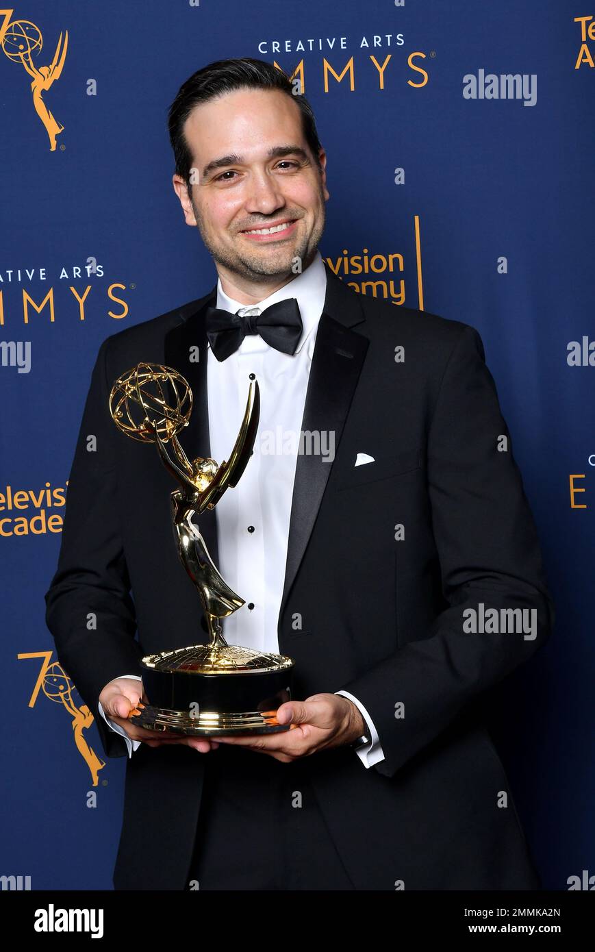 Ryan Ridley, winner of the the award for outstanding animated program ...