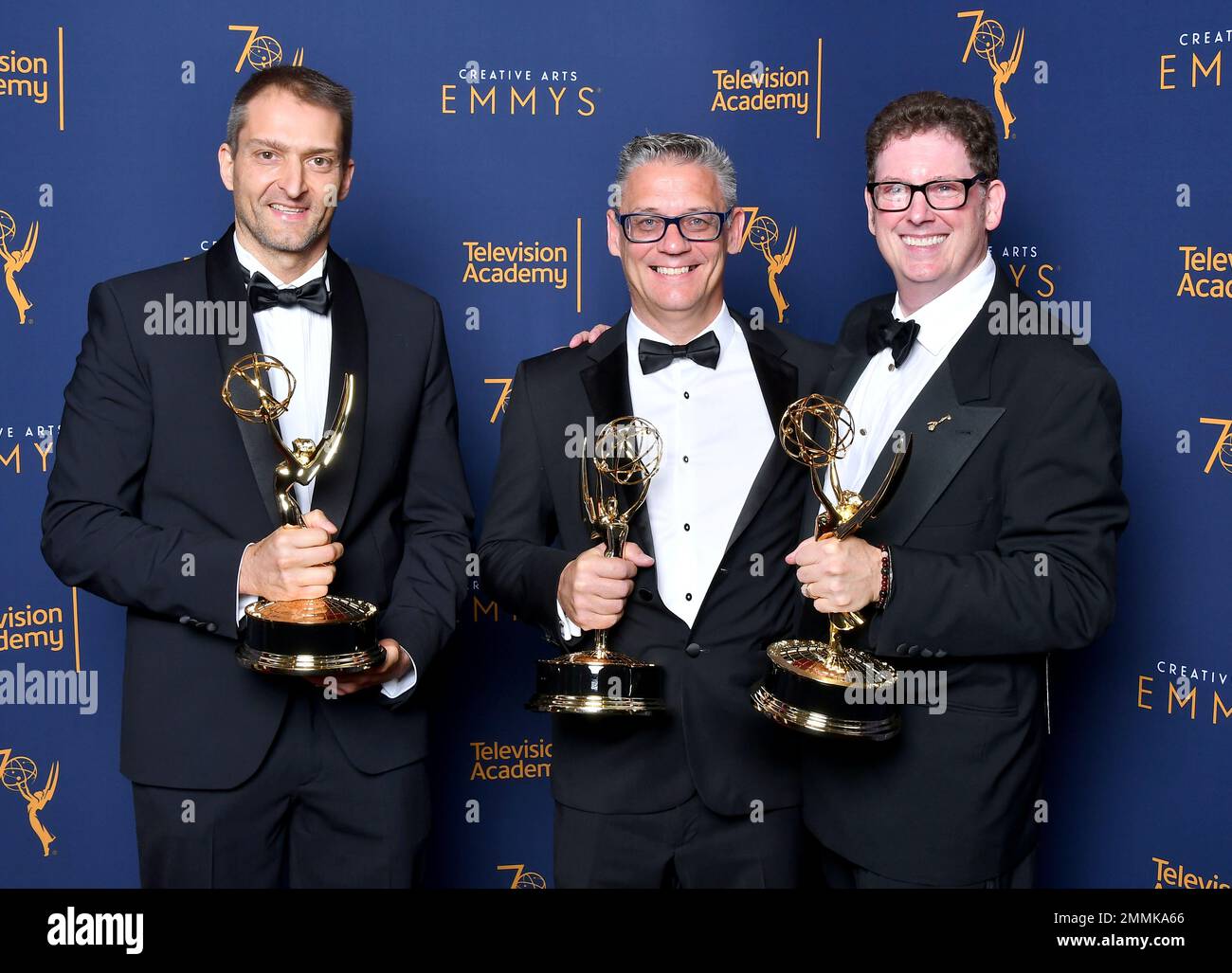 Tamas Csaba, from left, Mark Hensley and Bob Bronow, winners of the ...