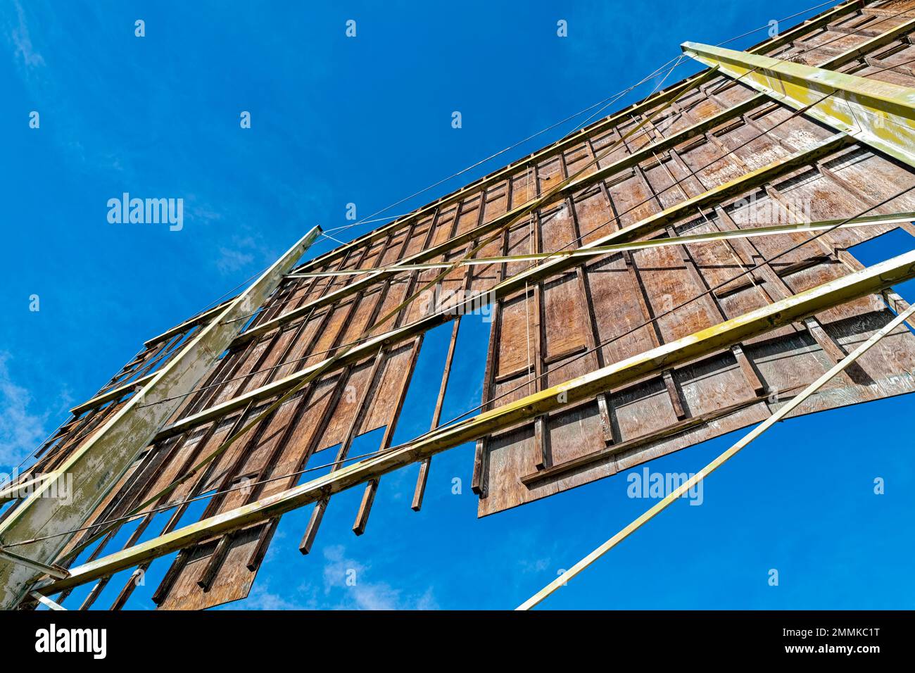 The rear of a wooden movie screen with missing boards at an abandoned ...