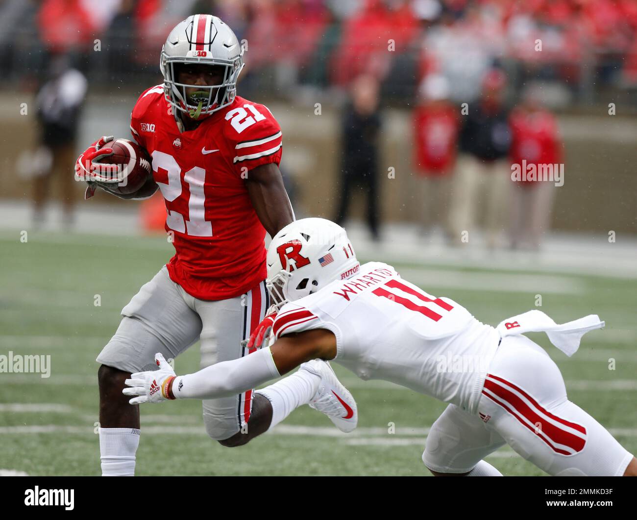 Ohio State receiver Parris Campbell, left, tries to escape the grasp of ...