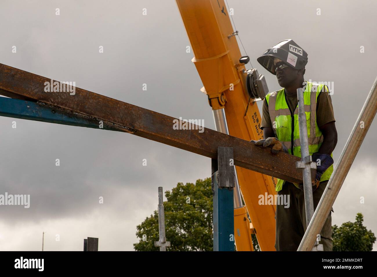 Members of the Republic of Fiji Military Force Engineers place a roof ...