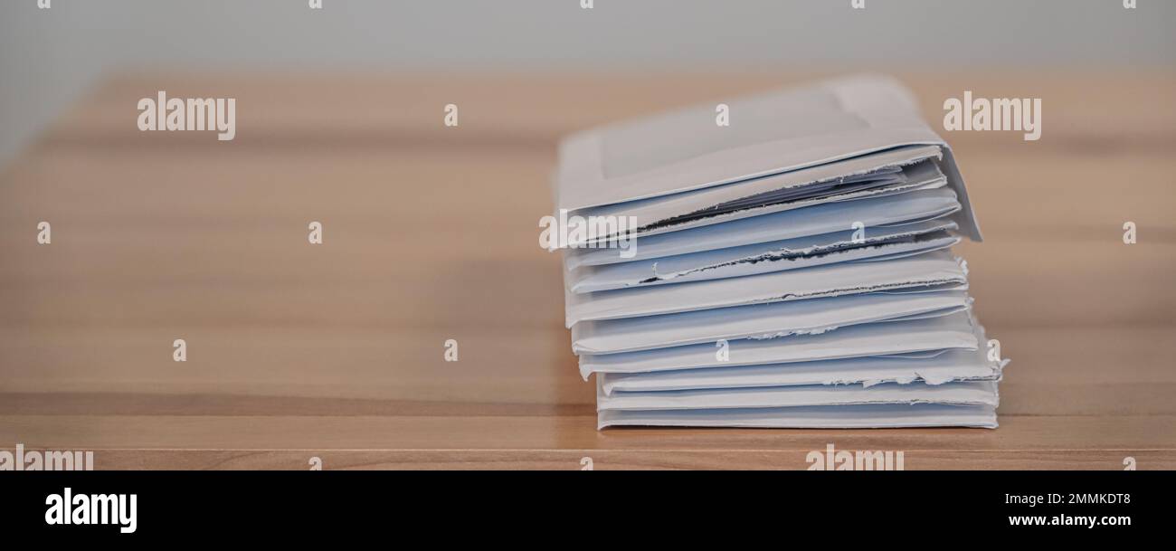 Stack pile of opened envelope letters to read Stock Photo - Alamy
