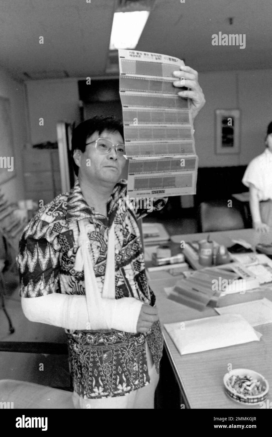 In this circa 1987 photo, AP photographer Kim Chon-kil looks at ...