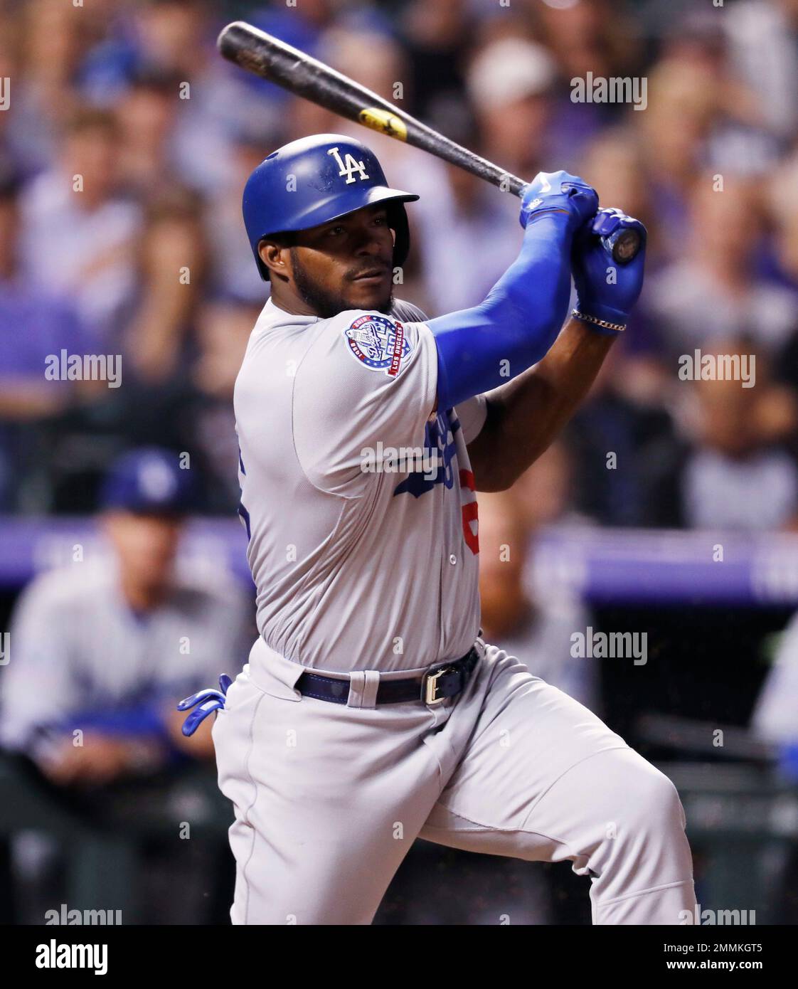 Los Angeles Dodgers' Yasiel Puig follows the flight of his RBI-single ...