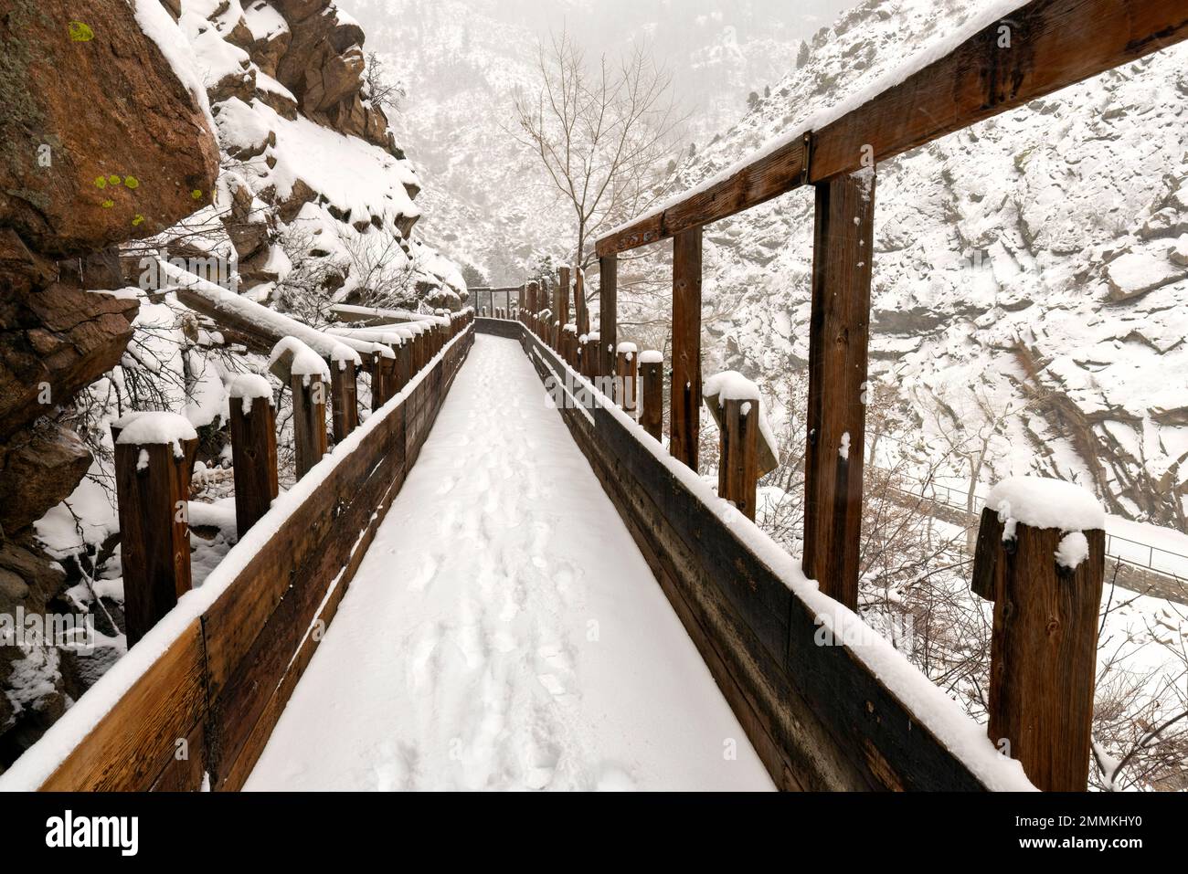 Snow-covered old wooden flume on Welch Ditch Trail in Clear Creek ...