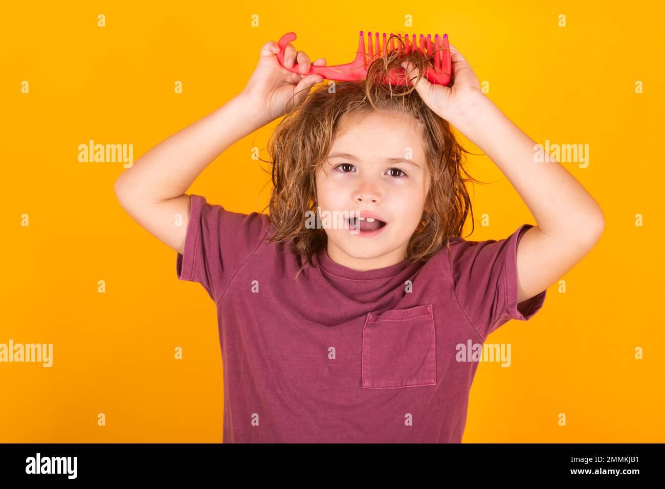 Kids hair. Child combing hair after shower. Cute child with comb ...