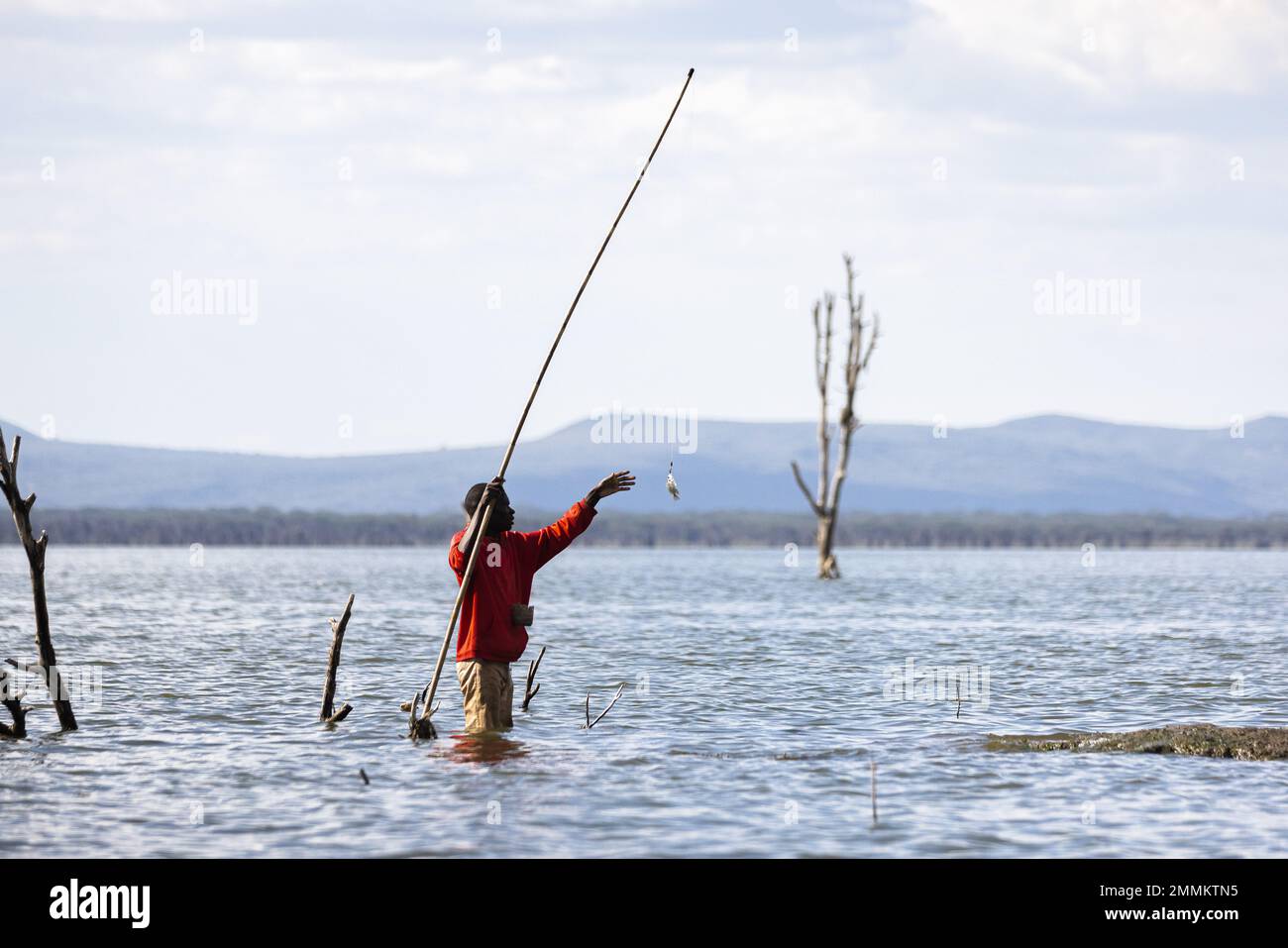 Man fishing in Lake Navaisha Stock Photo - Alamy
