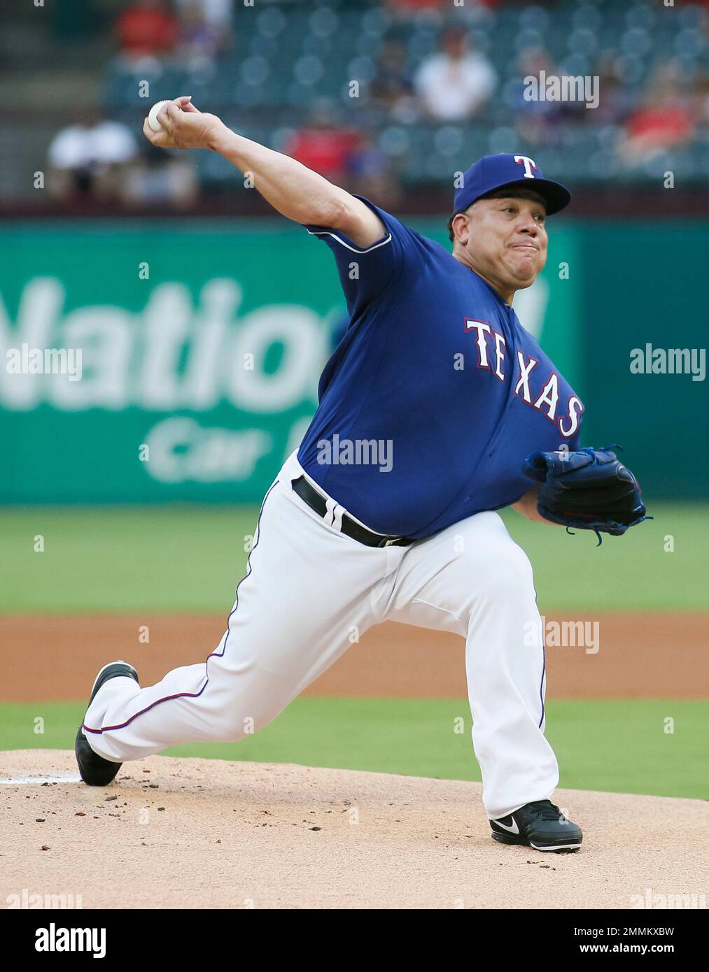 Texas Rangers starting pitcher Bartolo Colon delivers to the plate ...