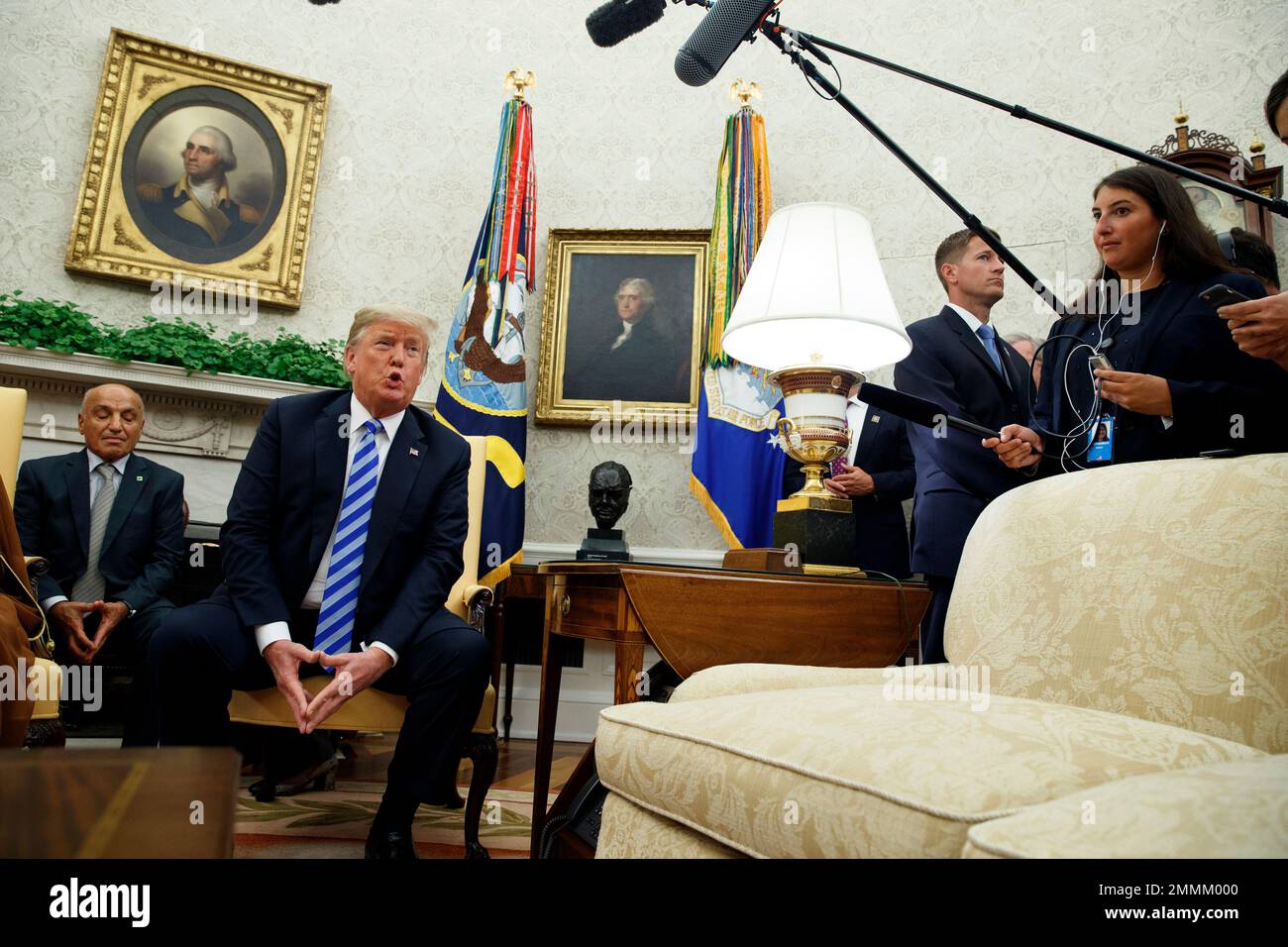 President Donald Trump speaks with reporters during a meeting with Emir ...