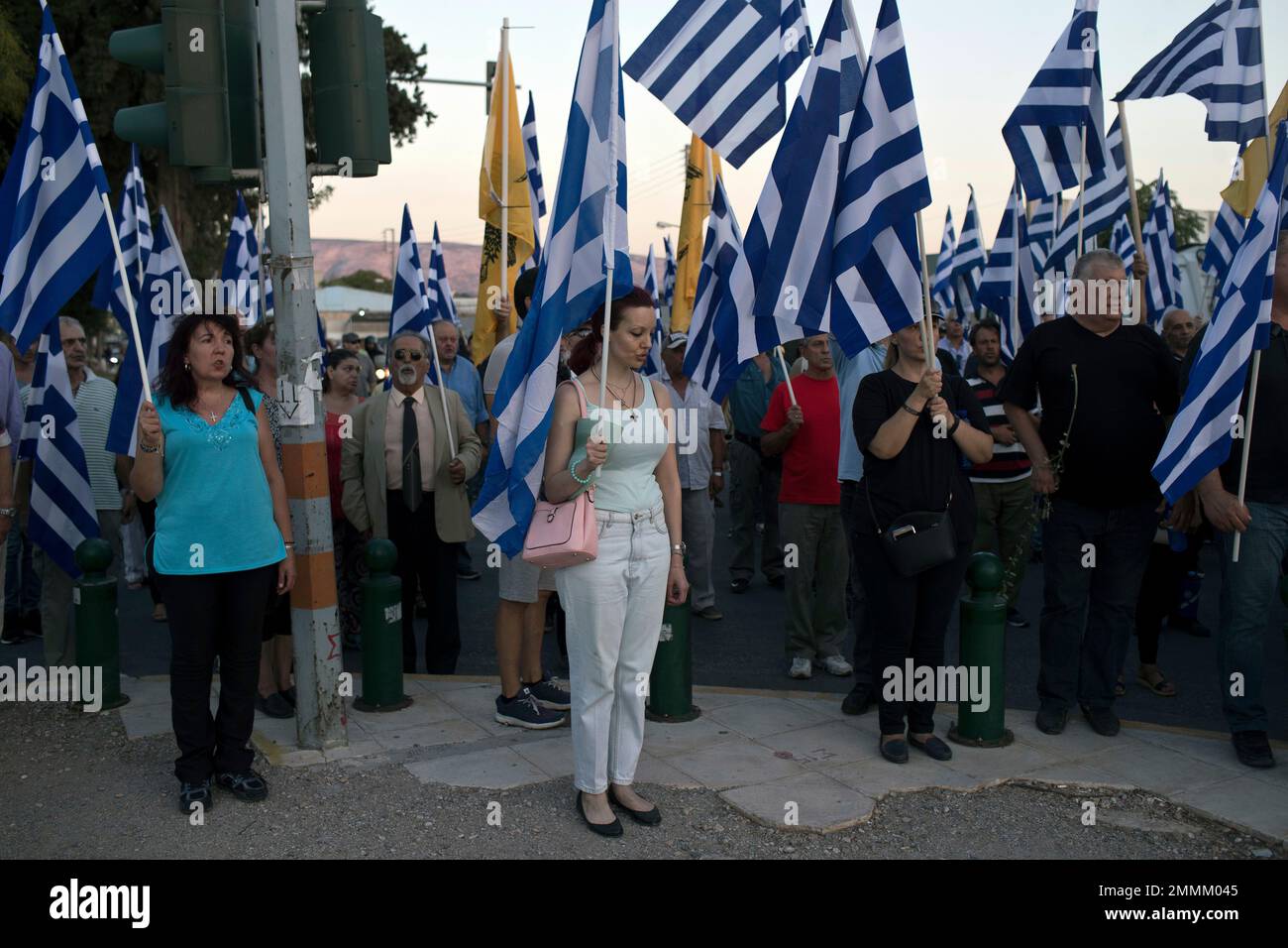 Supporter of Greece's extreme right Golden Dawn party hold Greek flags ...