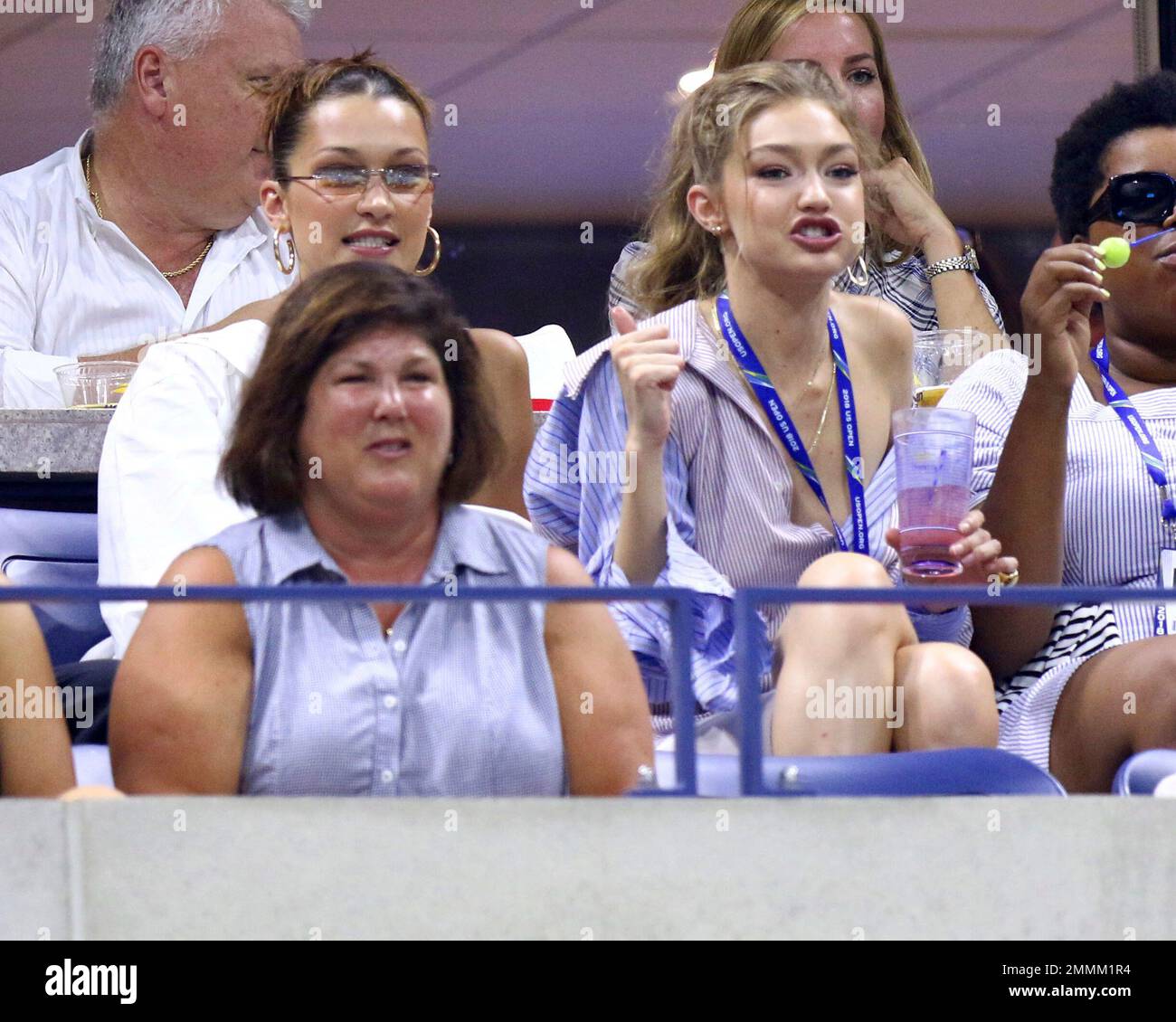 Bella Hadid, top left, and Gigi Hadid attend the quarterfinals of the U ...