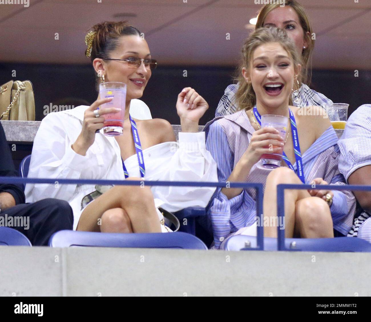 Bella Hadid, left, and Gigi Hadid attend the quarterfinals of the U.S ...