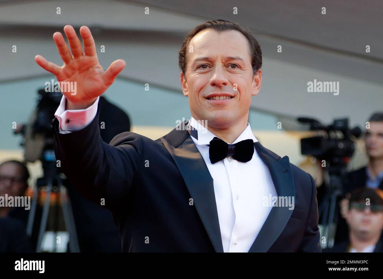 Actor Stefano Accorsi poses for photographers upon arrival at the ...