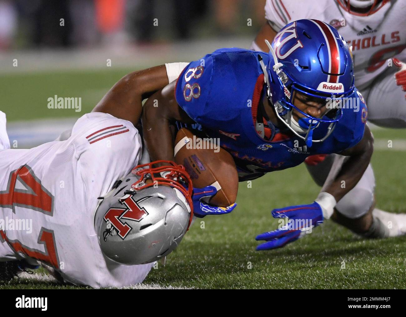 Kansas wide receiver Jeremiah Booker (88) is tackled by Nicholls State ...