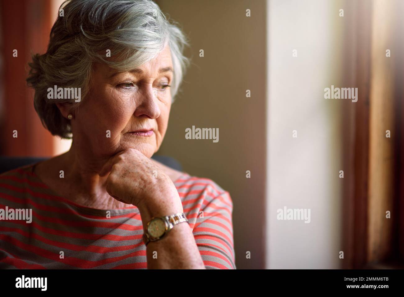 Life reflected in her thoughts. a thoughtful senior woman looking out ...