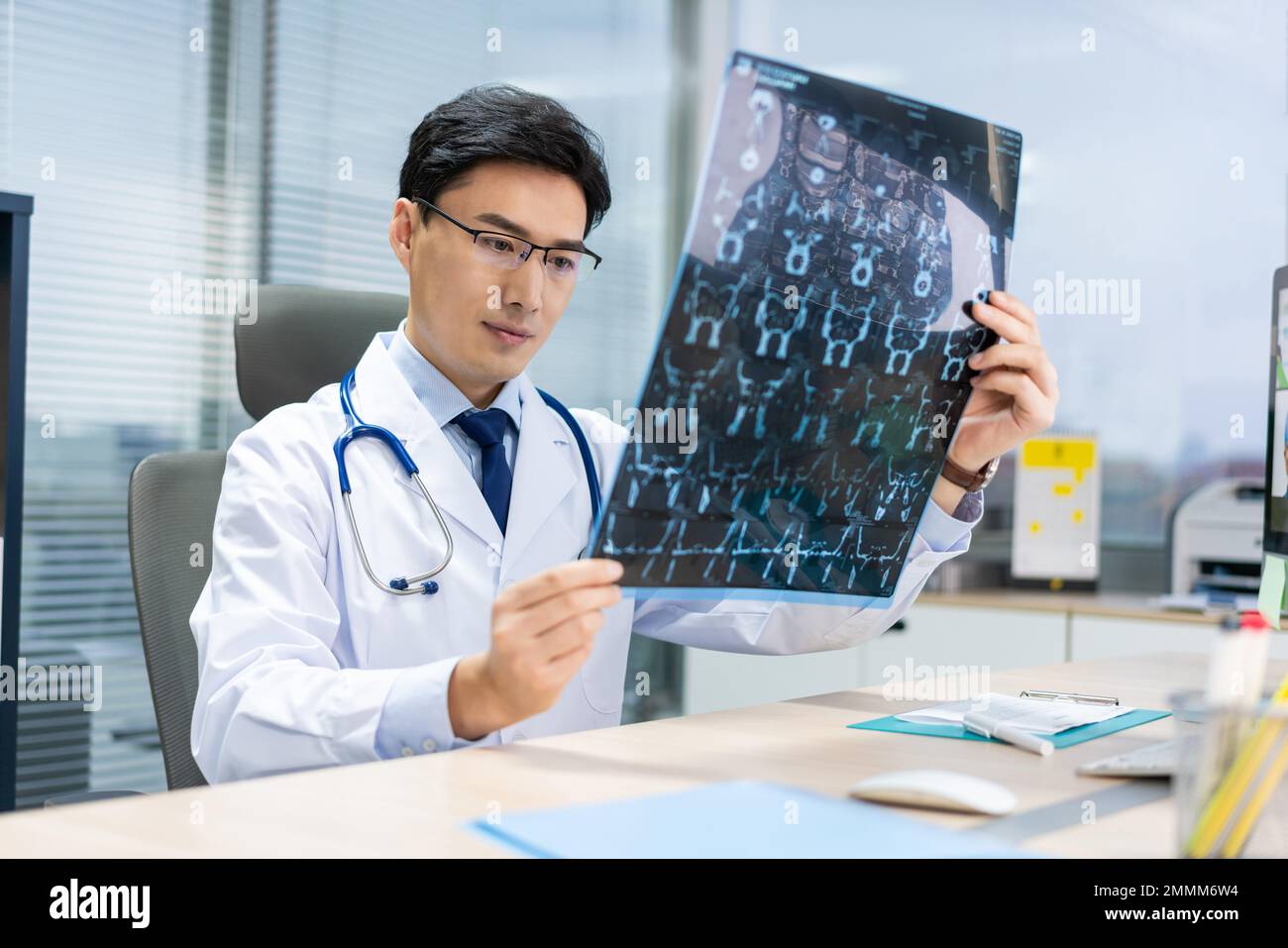 The young doctor to see x-rays Stock Photo - Alamy